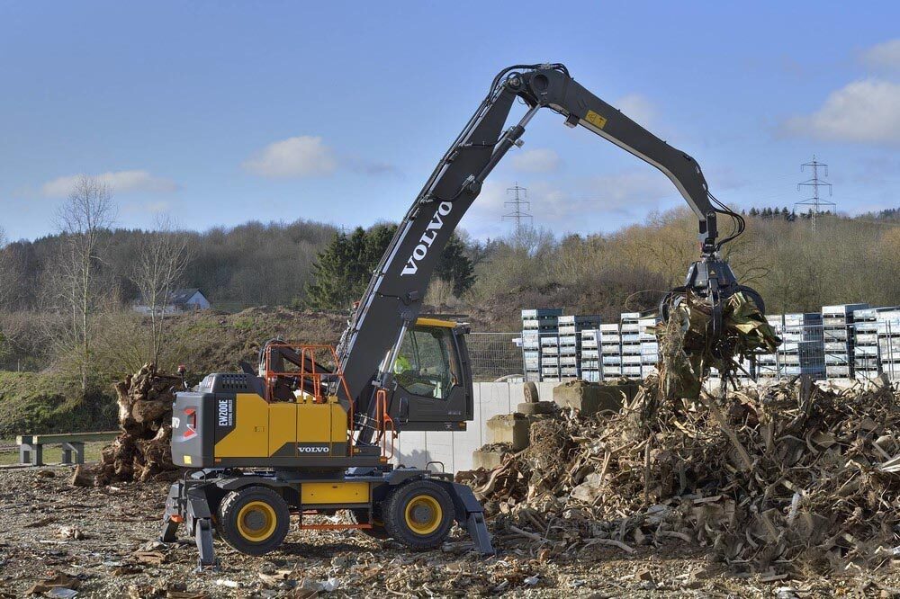 Born for garbage disposal, Volvo launches EW200E material handling ...
